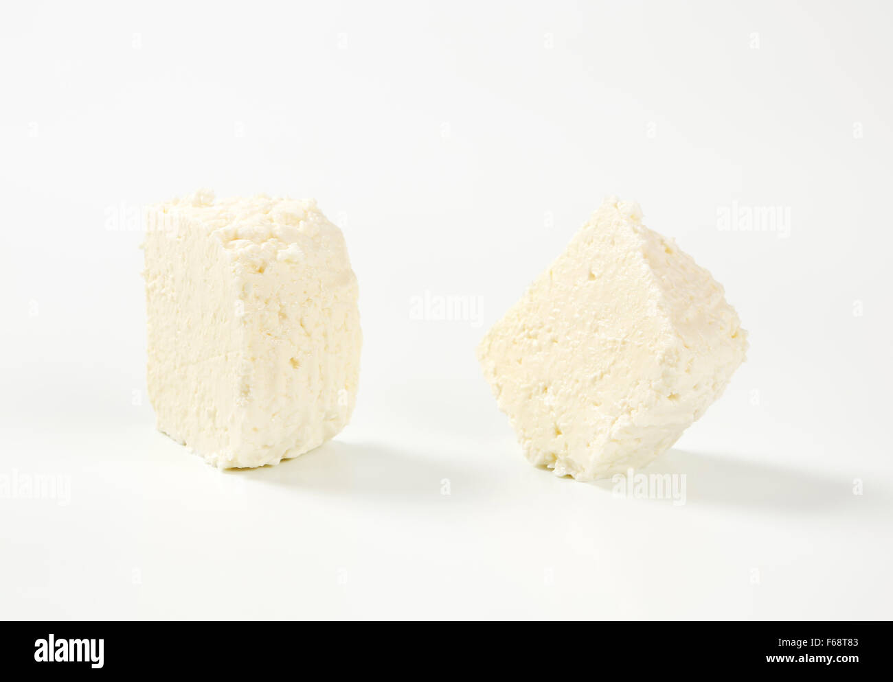 slices of fresh curd cheese on white background Stock Photo - Alamy