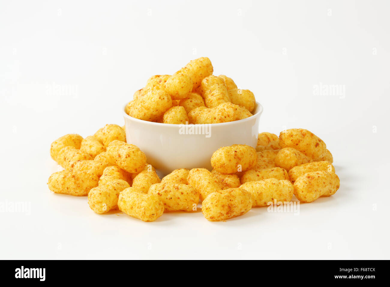 bowl of peanut crisps on white background Stock Photo - Alamy