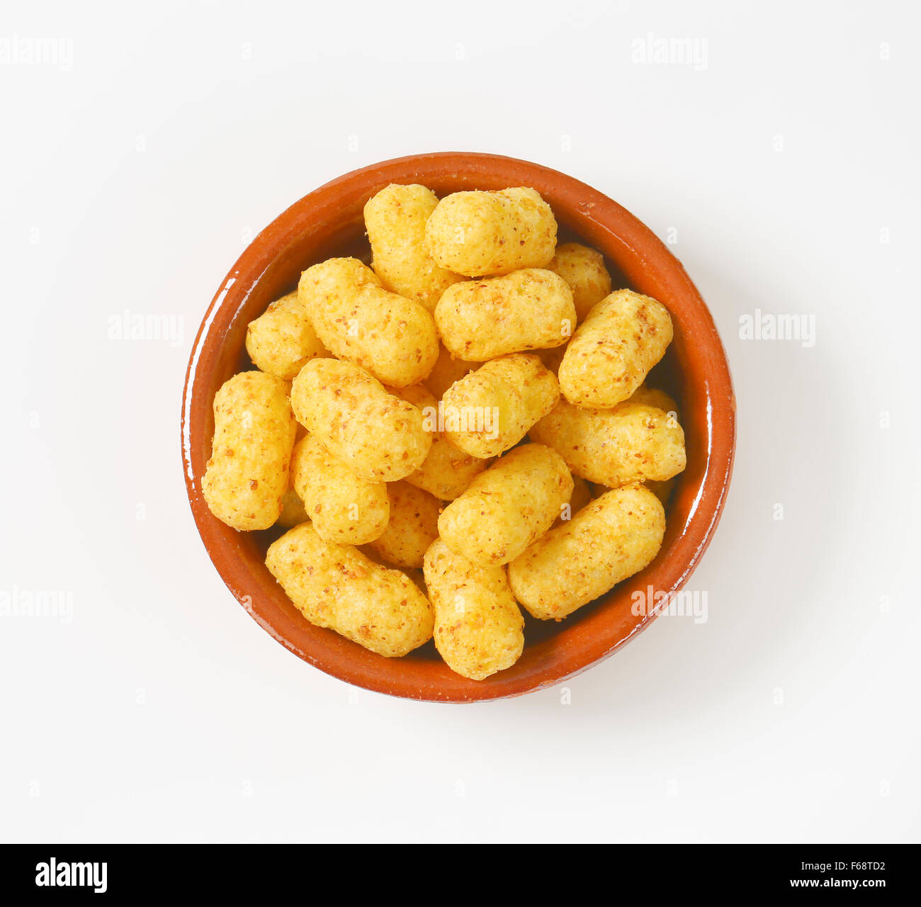 bowl of peanut crisps on white background Stock Photo - Alamy