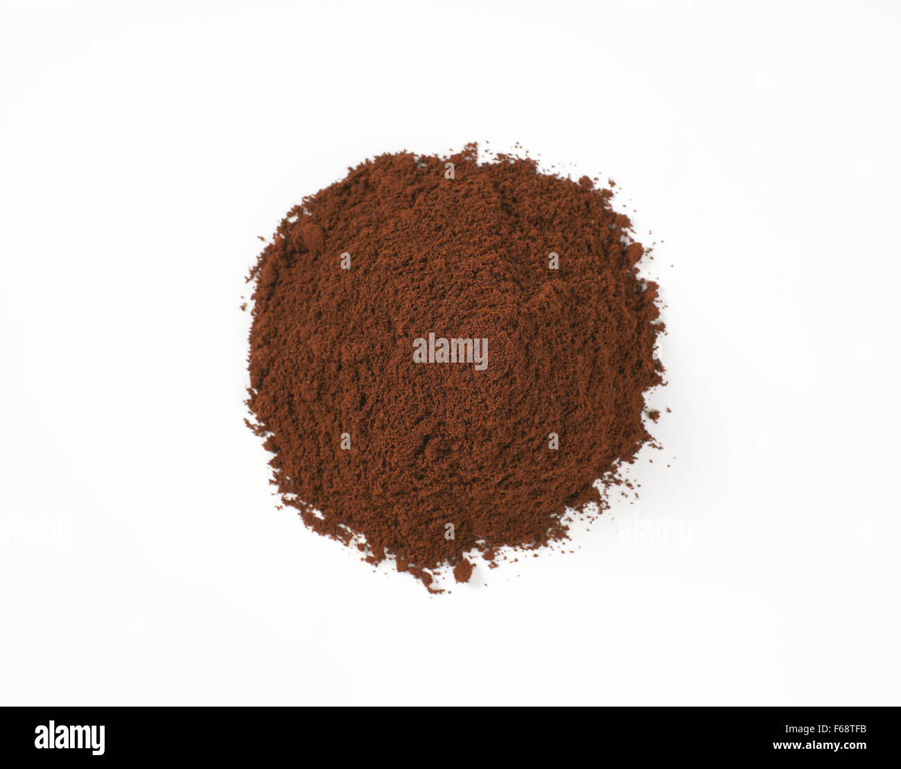 heap of freshly ground coffee on white background Stock Photo - Alamy