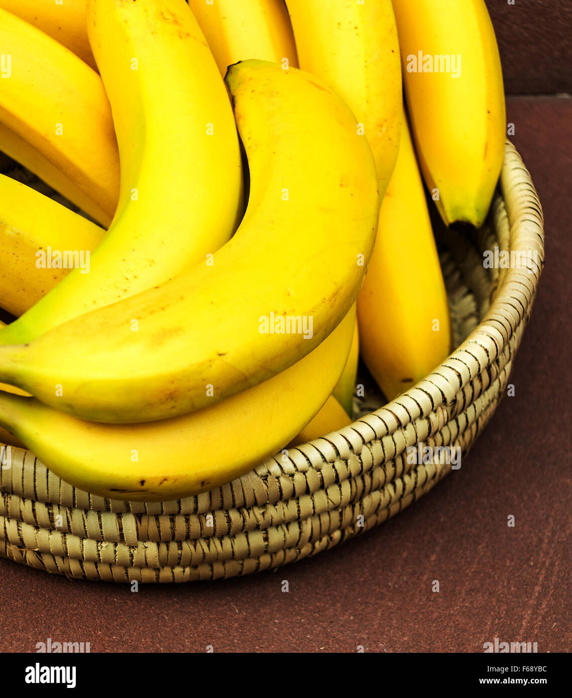 Ripe yellow bananas in small basket Stock Photo - Alamy