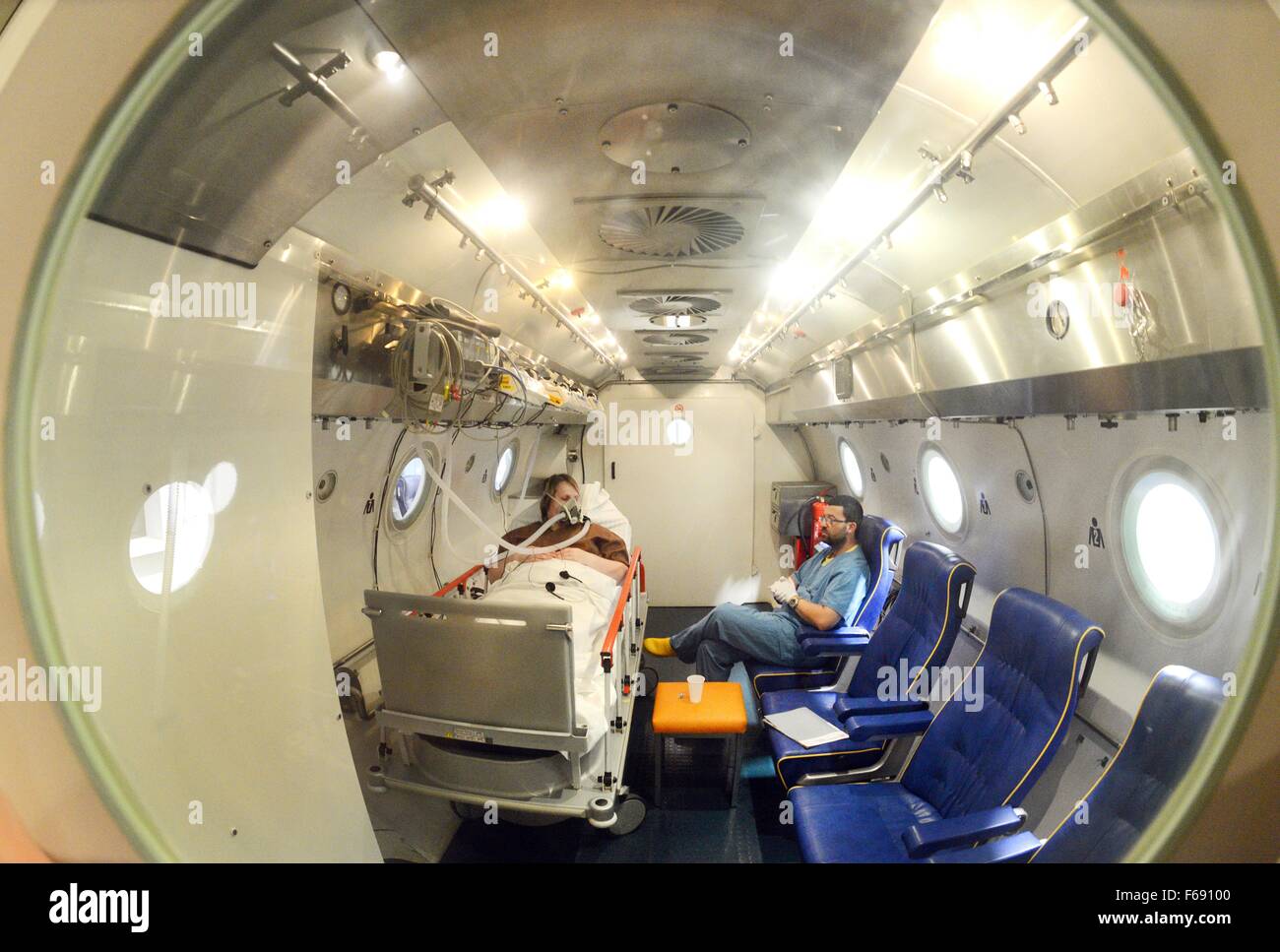 Anaesthetist and compression chamber physician Carsten Pohl (R) sits ...