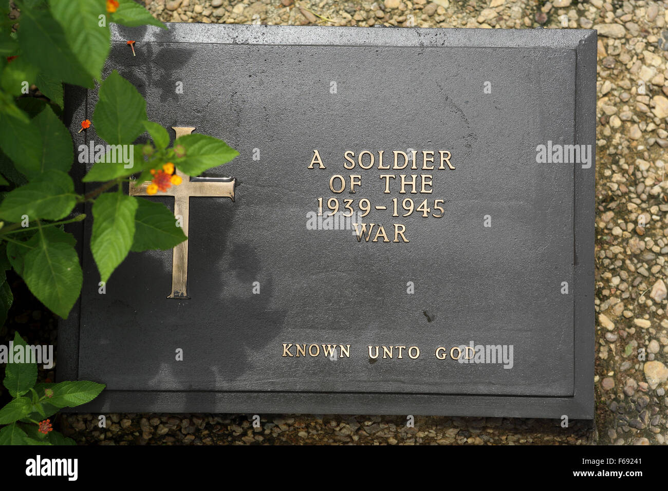 The grave of an unknown soldier at Taukkyan War Cemetery near Yangon ...