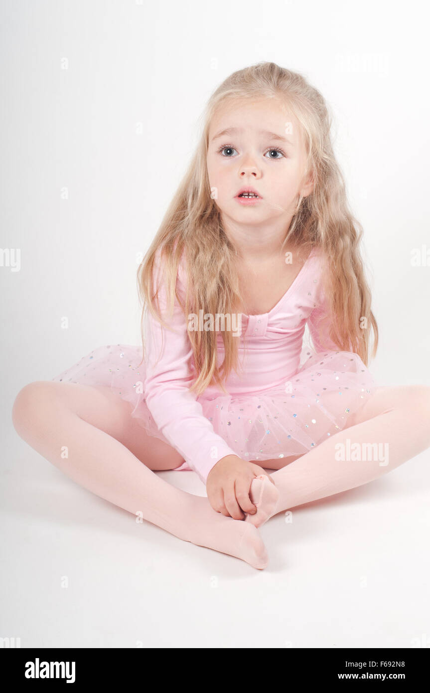 Ballet dancer sitting on the floor Stock Photo - Alamy