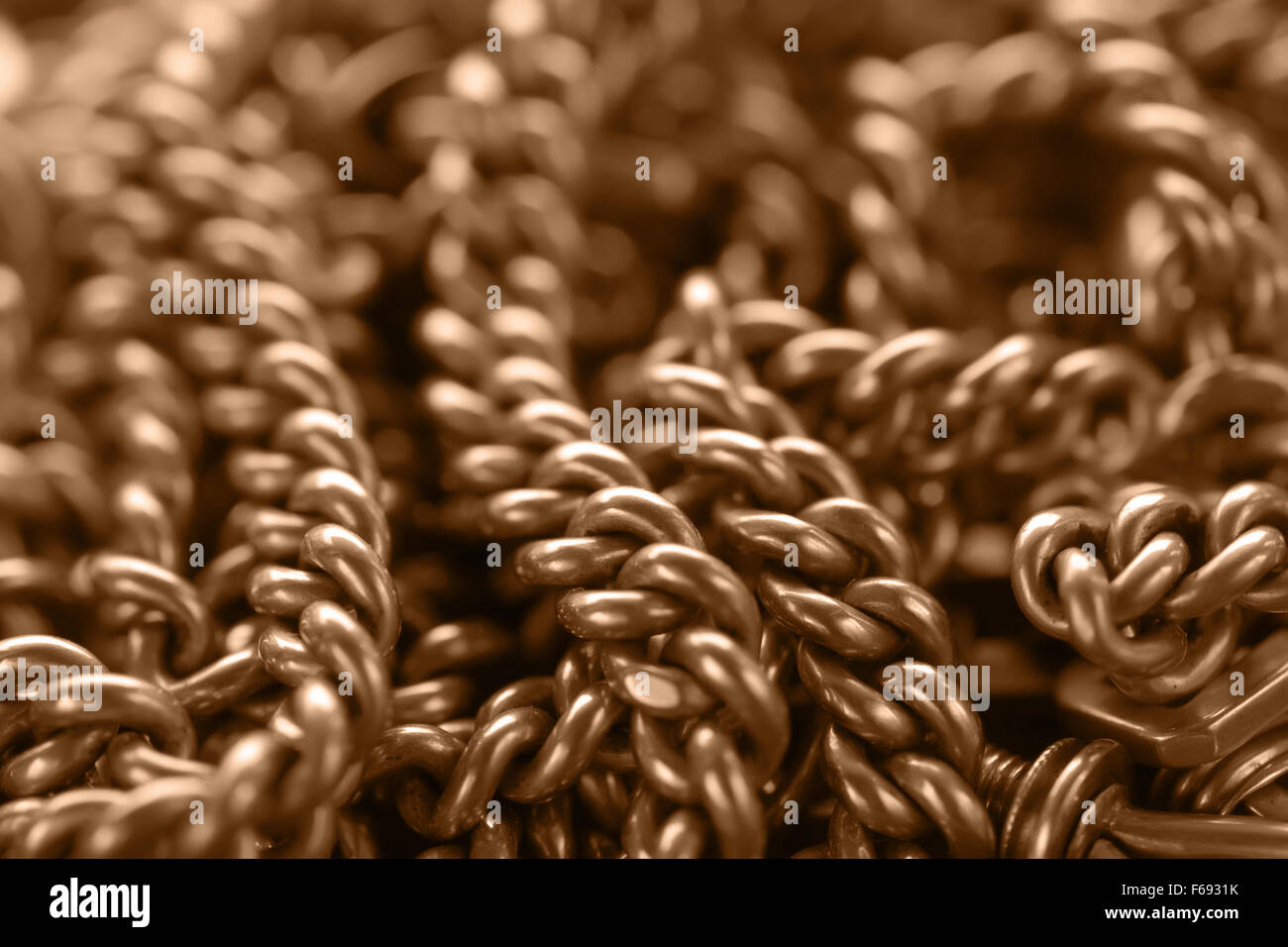 Blurred toned background with ancient golden chain Stock Photo - Alamy