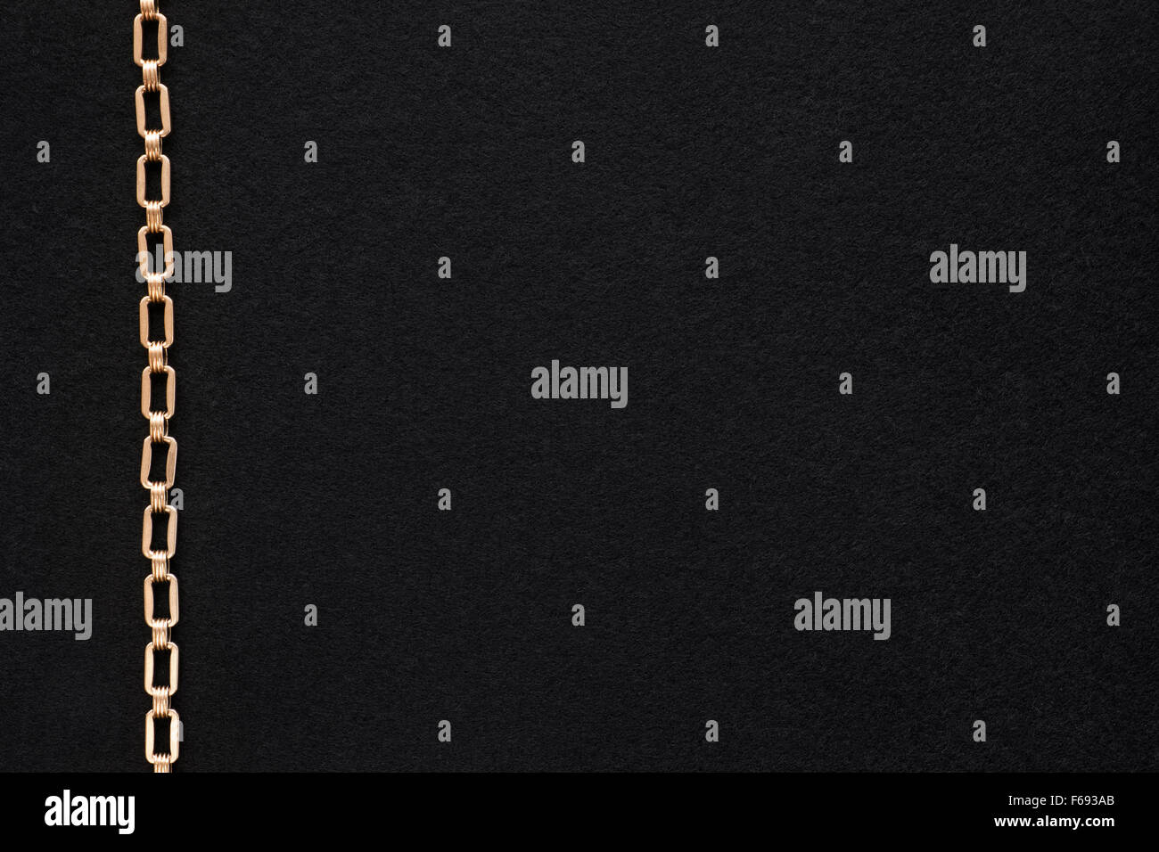 Black felt background with golden chain border Stock Photo - Alamy
