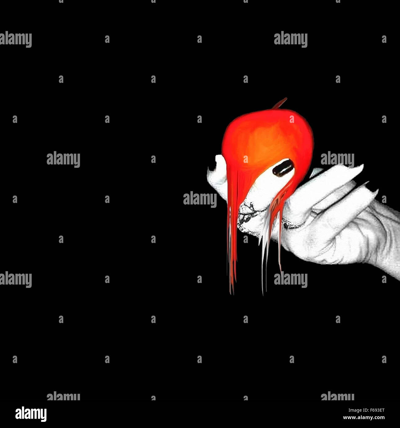 Temptation (womans hand holding onto a red apple Stock Photo - Alamy