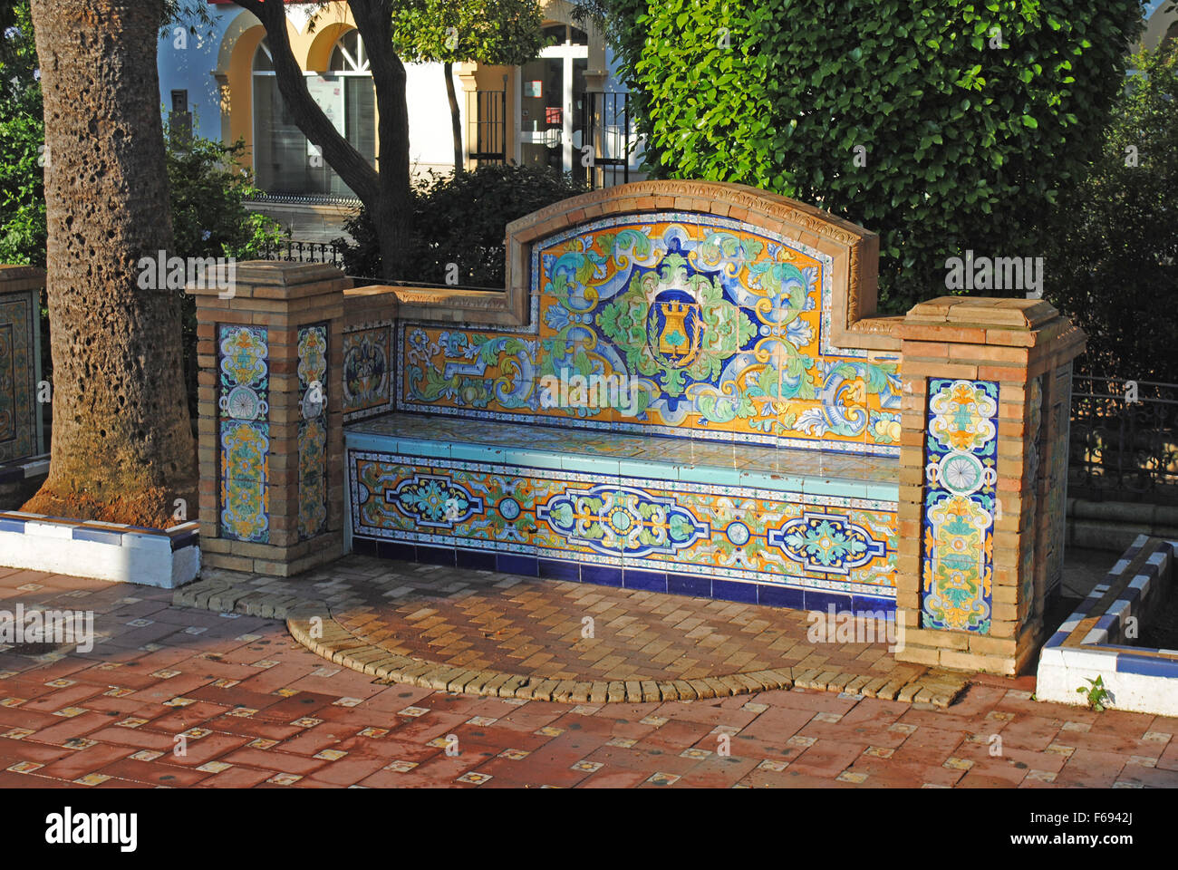 A bench covered with typical Andalusian tiles in the centre of the ...