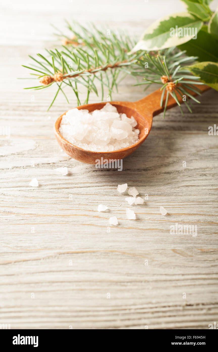Aromatic bath salt in a wooden spoon and pine branch Stock Photo - Alamy