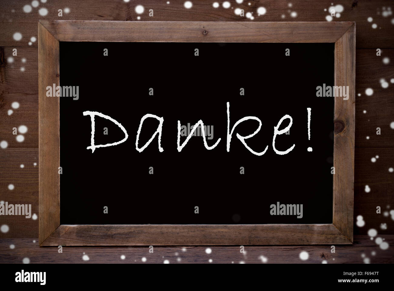 Chalkboard With Danke Means Thank You, Snowflakes Stock Photo - Alamy