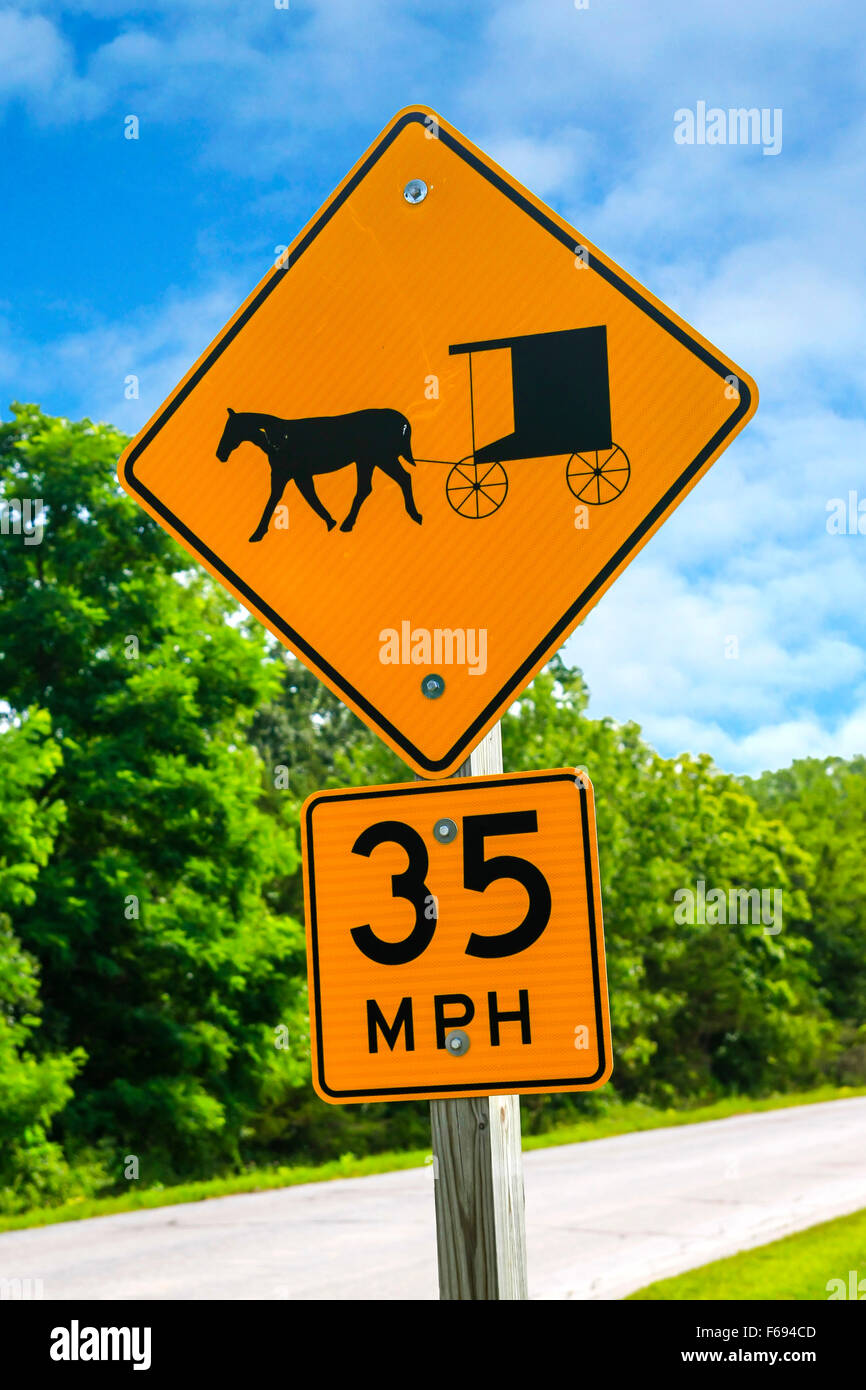 Yellow traffic sign warning vehicle drivers of Amish horse and buggies ...