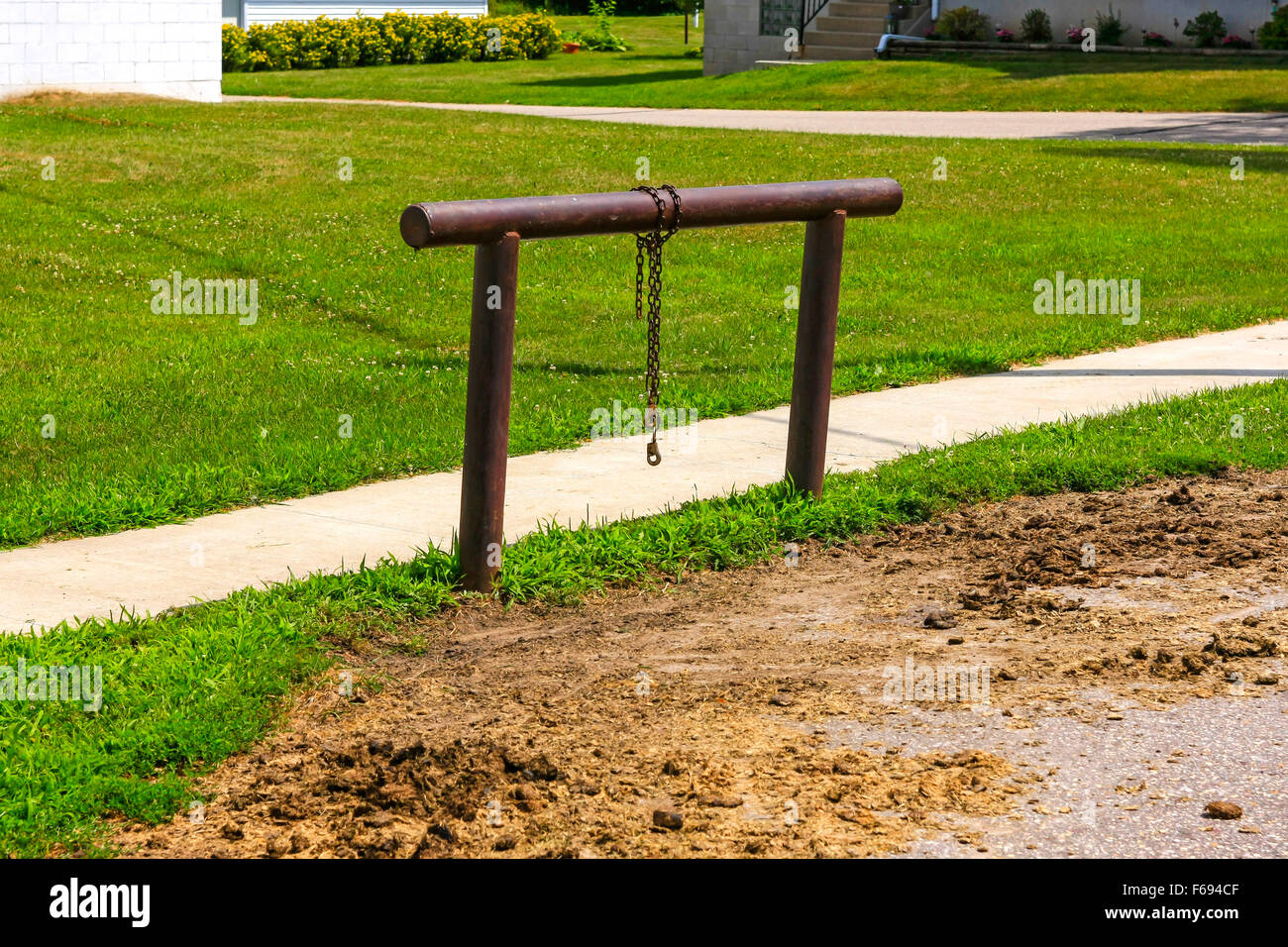Metal Hitching Post For Amish Horses In A Small Rural Town In Stock metal-hitching-post-for-amish-horses-in-a-small-rural-town-in-stock