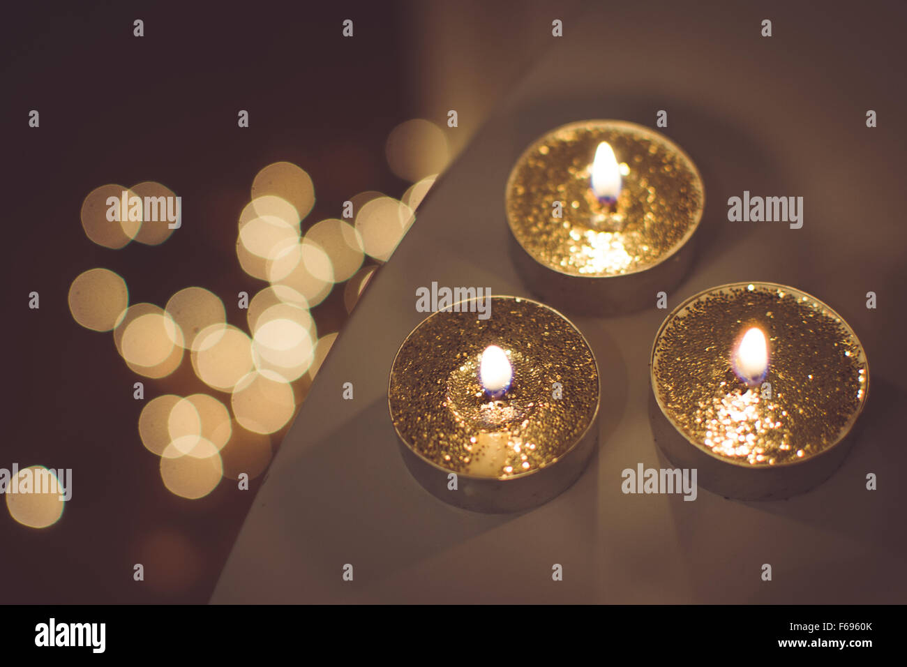 Christmas golden candles Stock Photo - Alamy