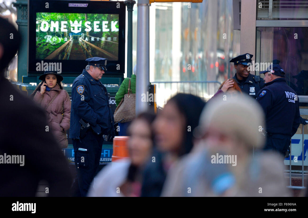 New York, USA. 14th Nov, 2015. Police officers stand guard in the Times ...