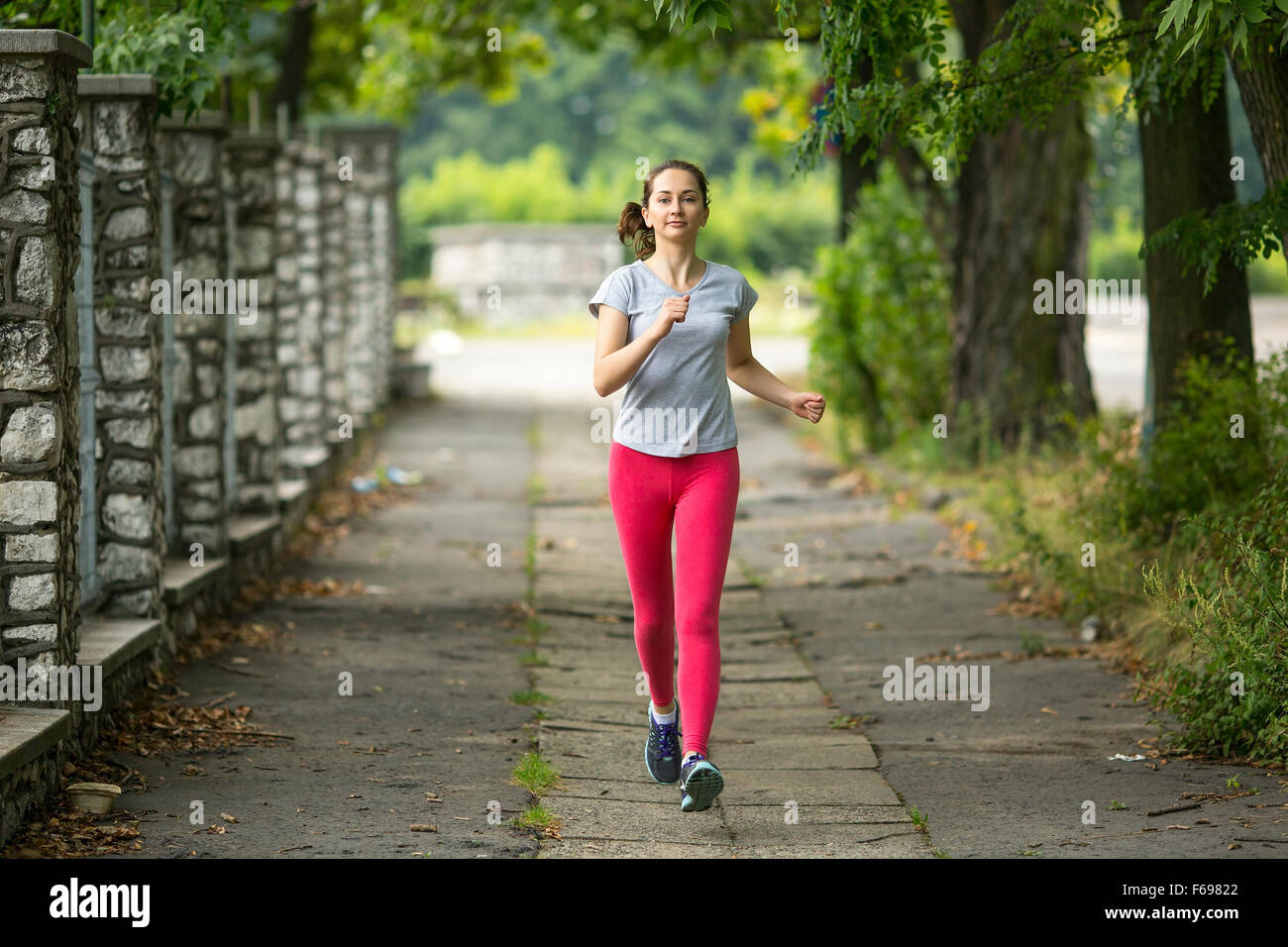 A young woman doing morning jog in the Park Stock Photo - Alamy