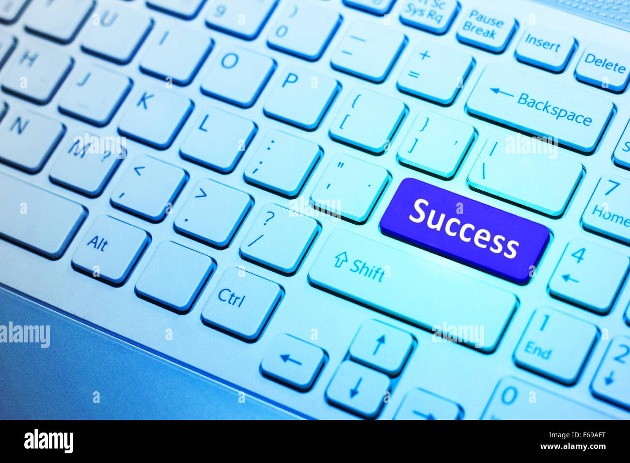 Keyboard with blue Success button, business concept Stock Photo - Alamy