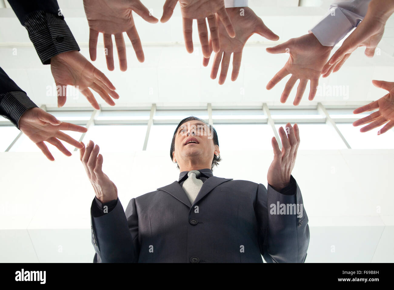 Businessman looking up in crowd hi-res stock photography and images - Alamy