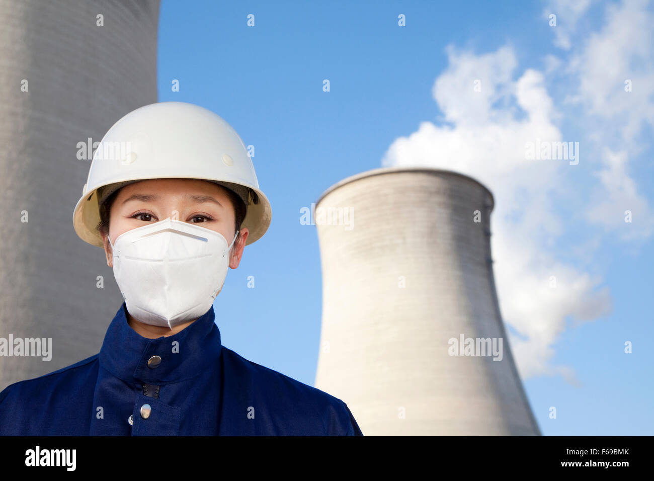 Worker with hardhat and mask at power plant Stock Photo - Alamy
