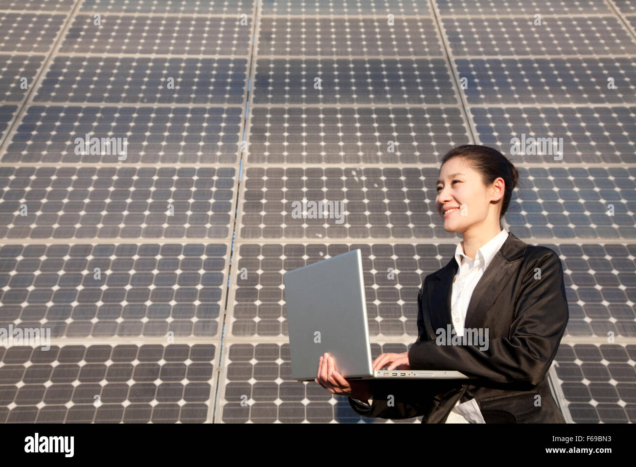 Woman asia solar panel hi-res stock photography and images - Alamy
