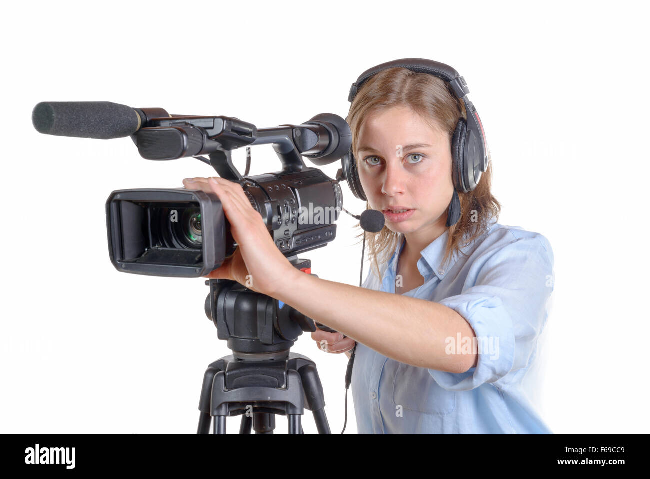 A young woman with a video camera and headphone Stock Photo - Alamy