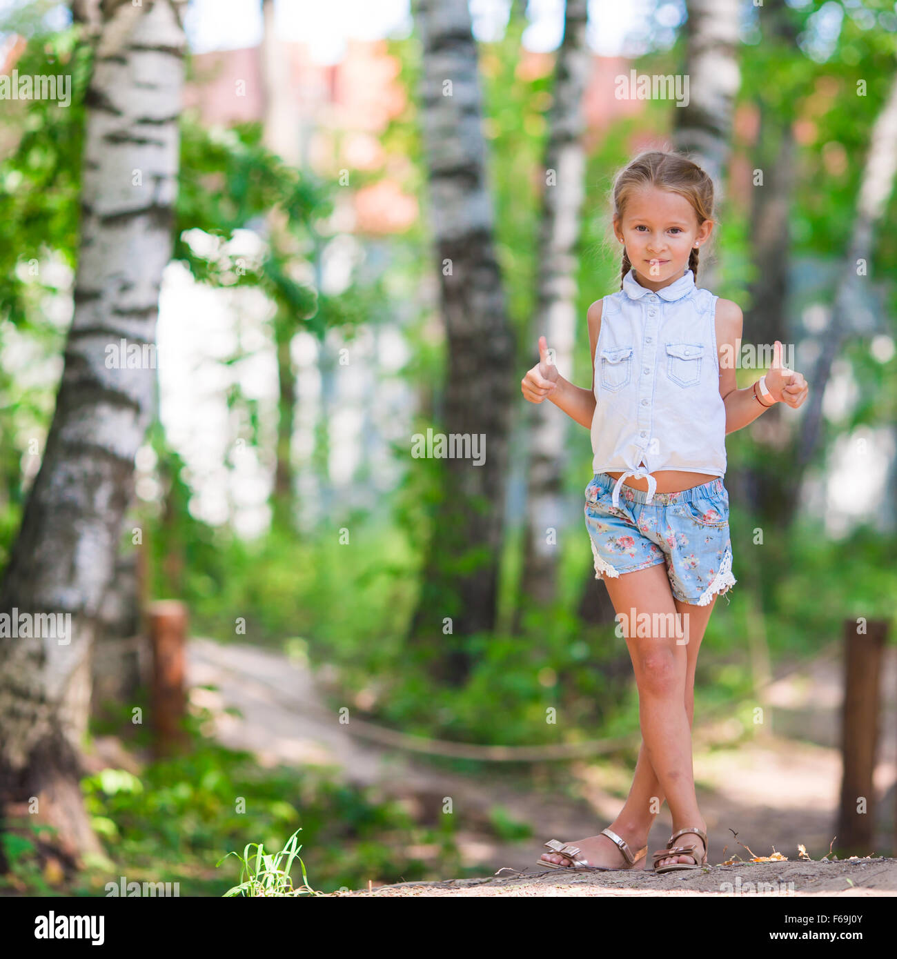 Little cute girl in summer park outdoors Stock Photo - Alamy
