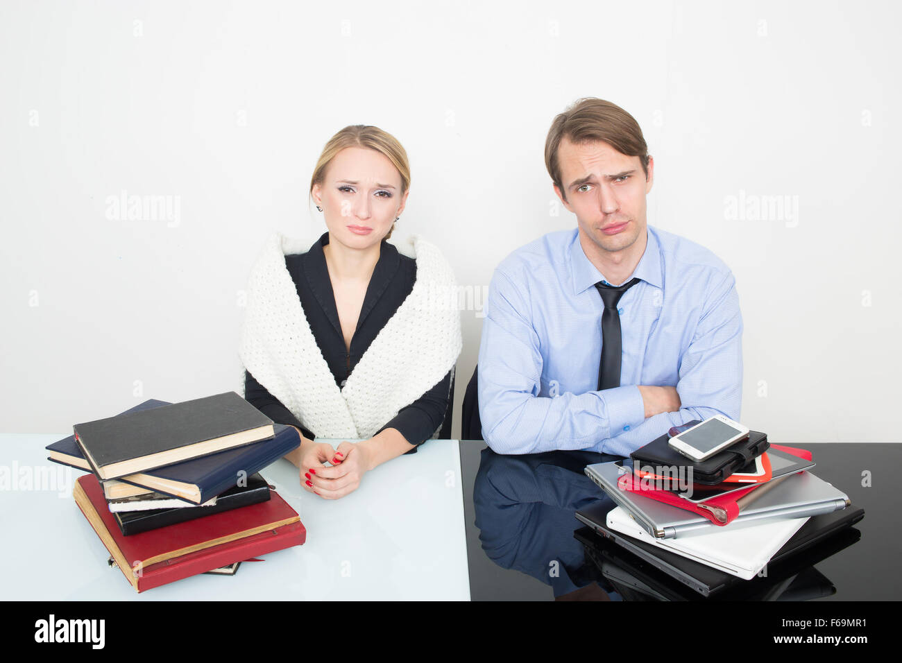 woman with stack books. man. set of phones, tablets, laptops. sadness ...