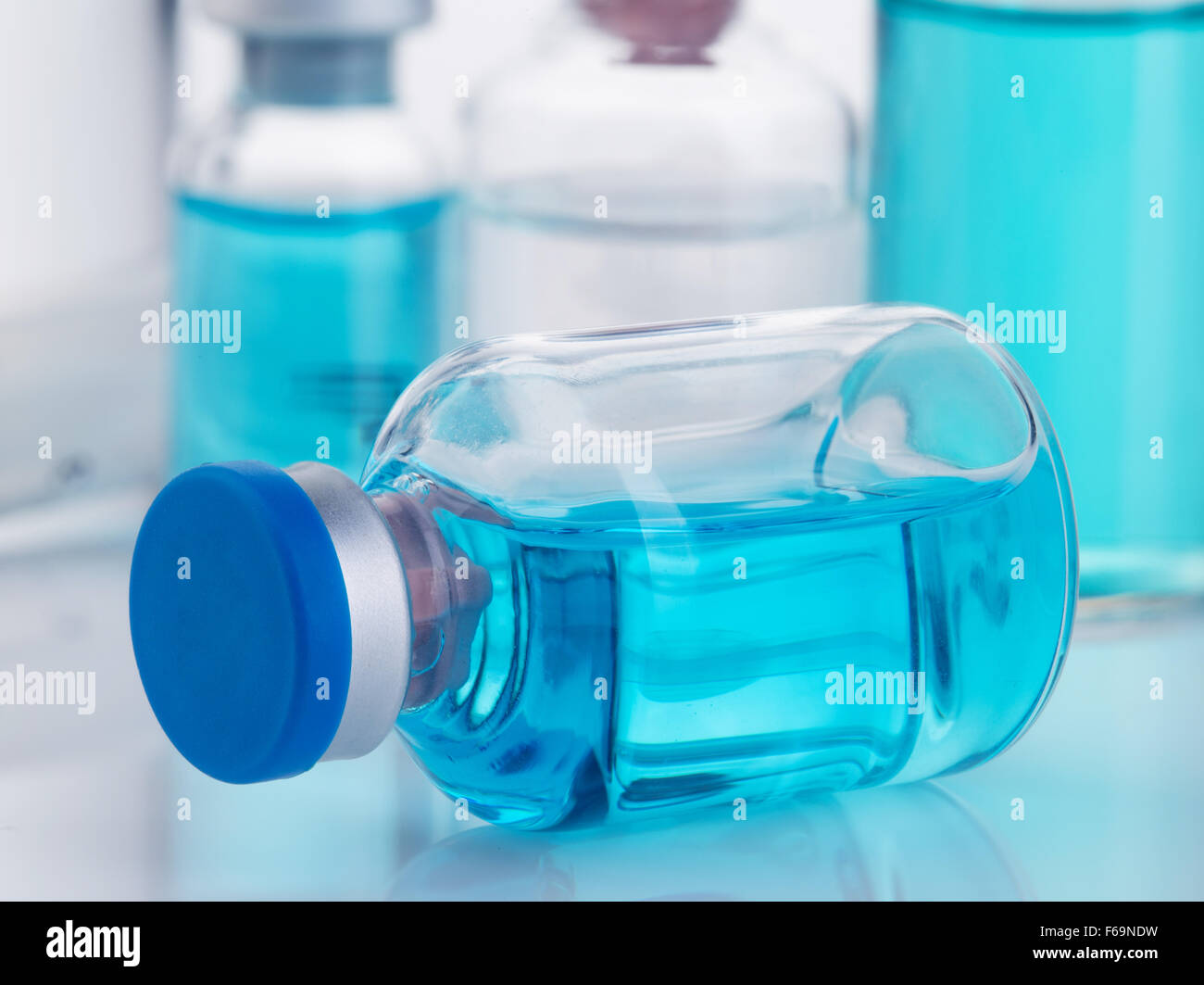 Vial with blue solution close-up Stock Photo - Alamy