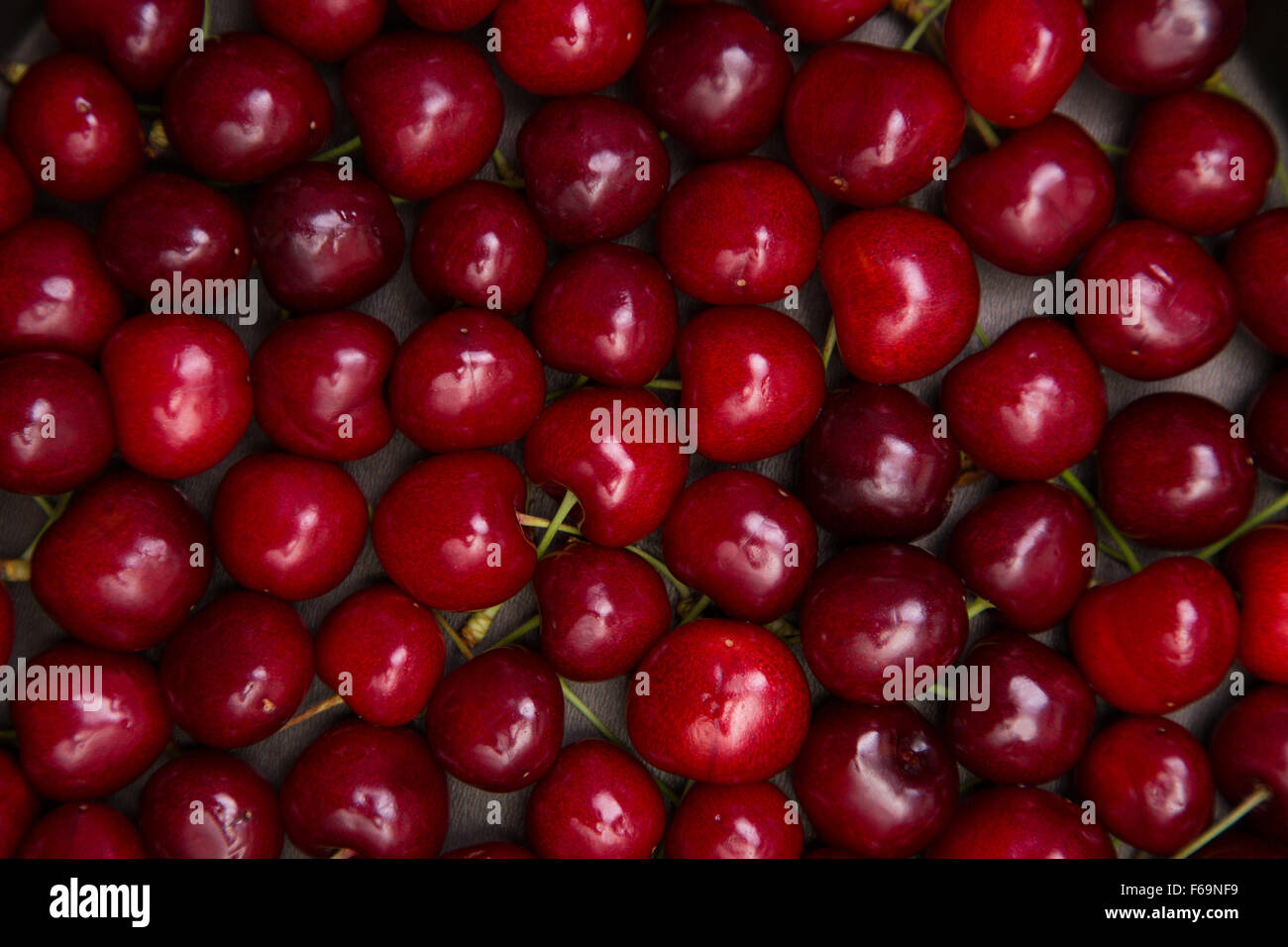 Fresh red cherry texture, top view Stock Photo - Alamy