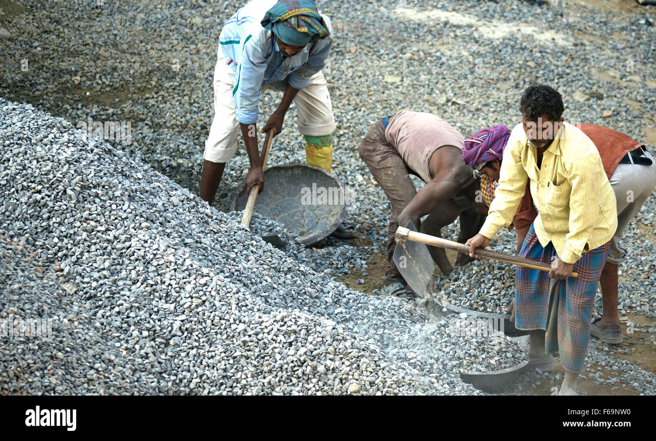 Construction site- Manual worker working Stock Photo - Alamy