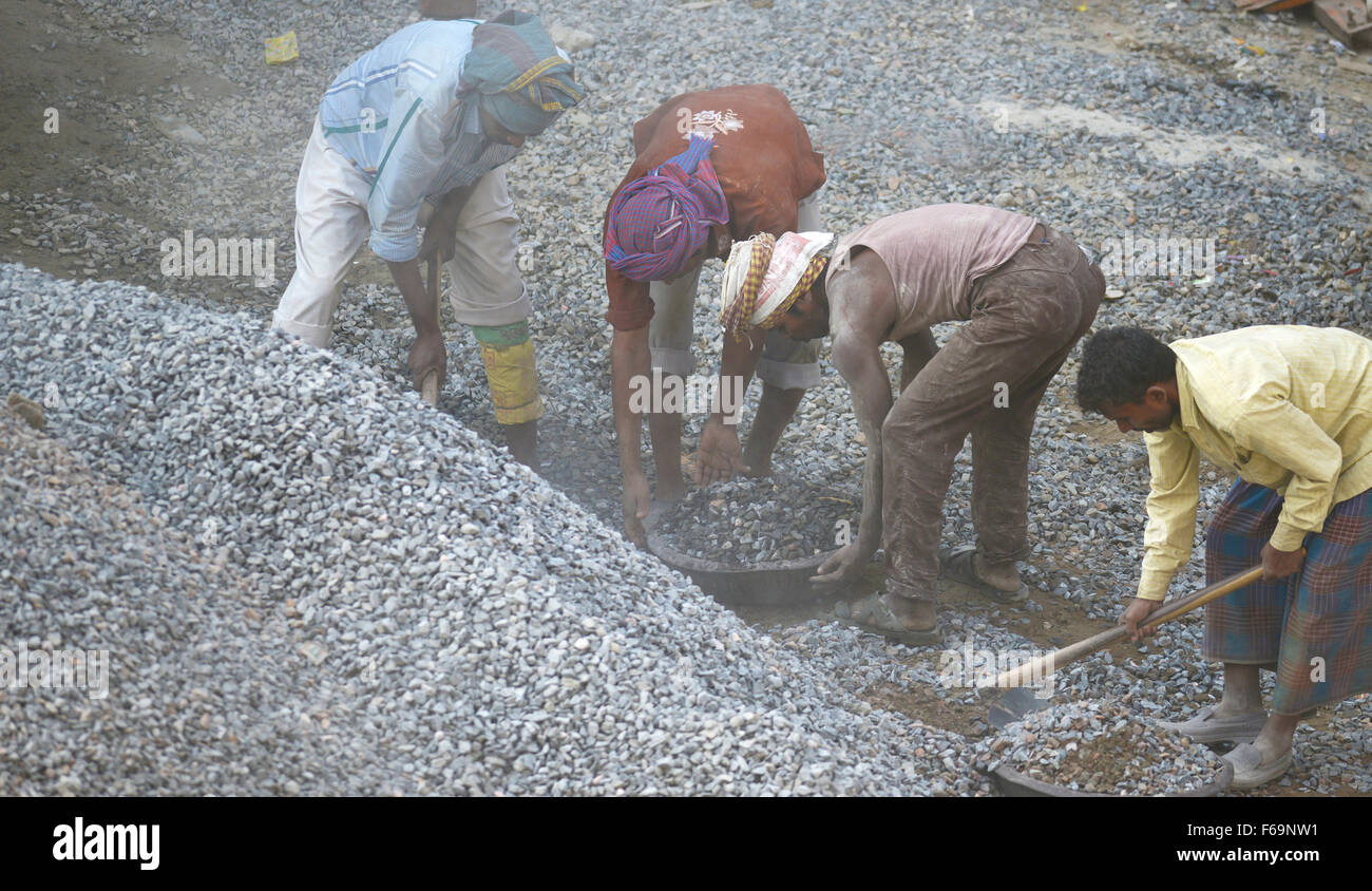 Construction site- Manual worker working Stock Photo - Alamy