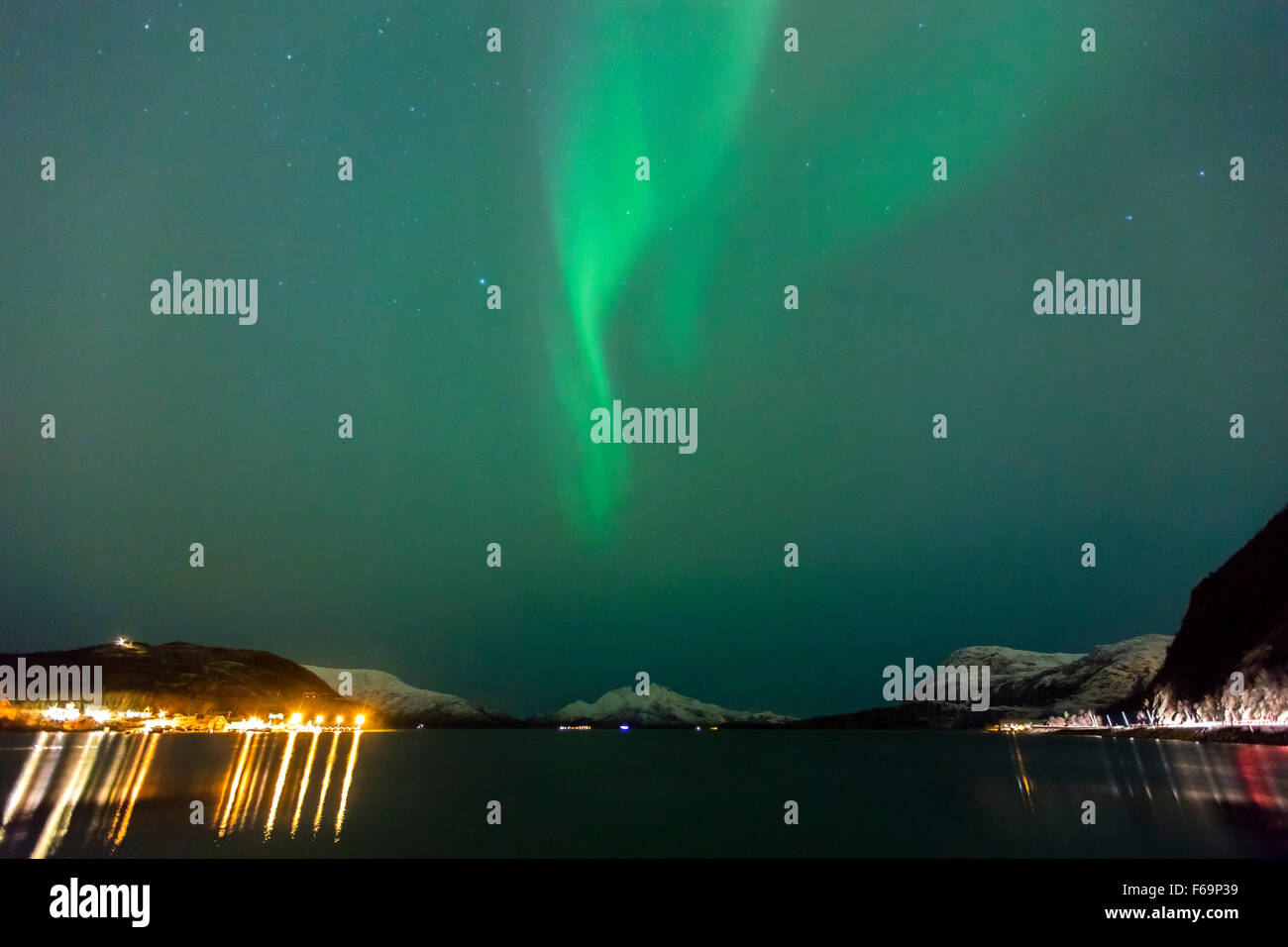 Beautiful northern lights over a fjord at night Stock Photo - Alamy