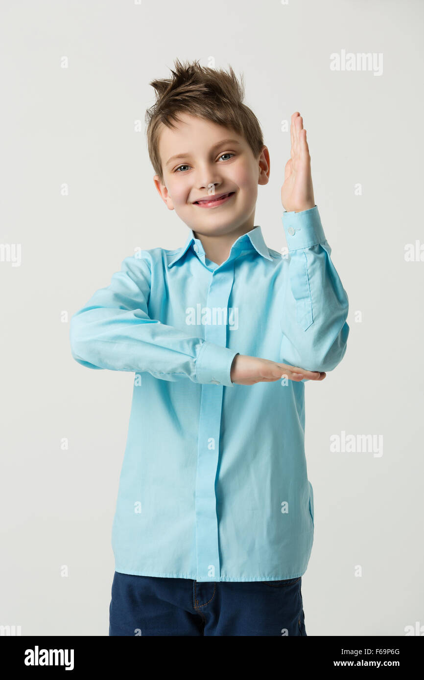 School child with hand up Stock Photo - Alamy