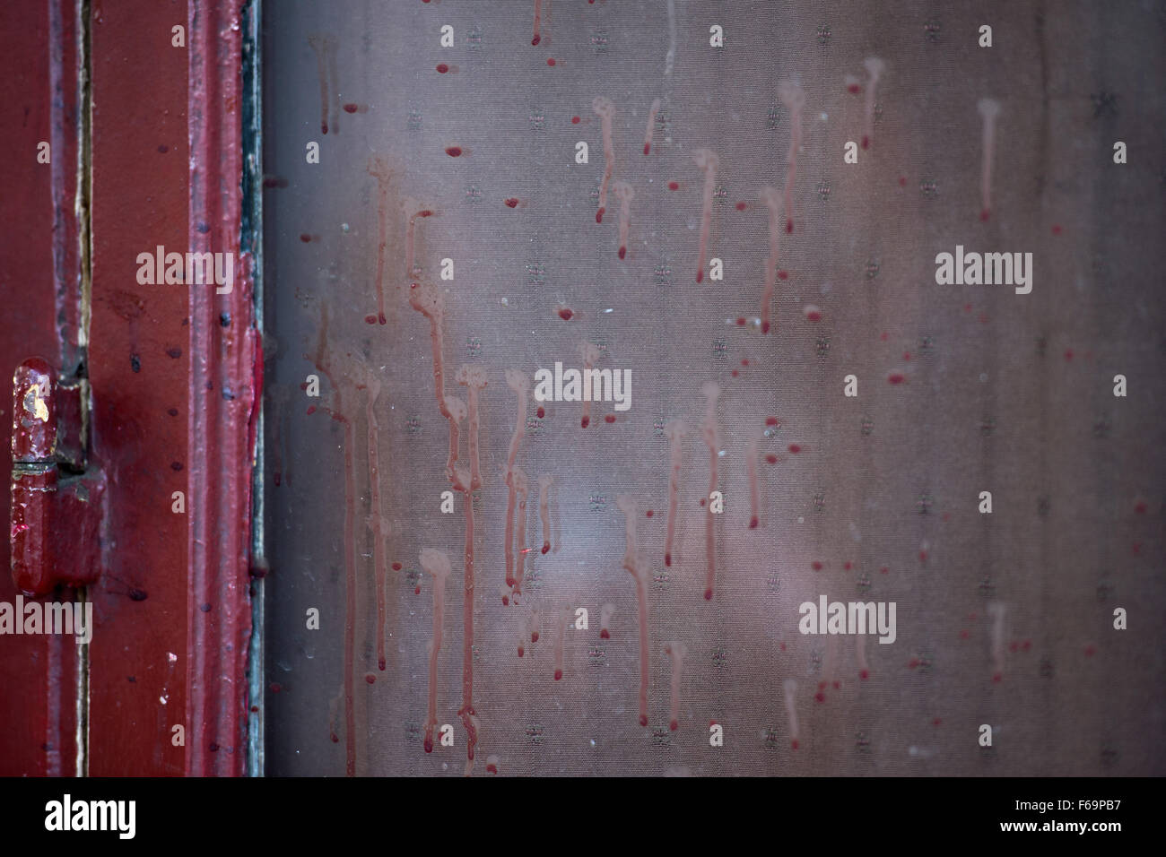 Paris, France. 15th Nov, 2015. Stains of blood stick to a window panel ...