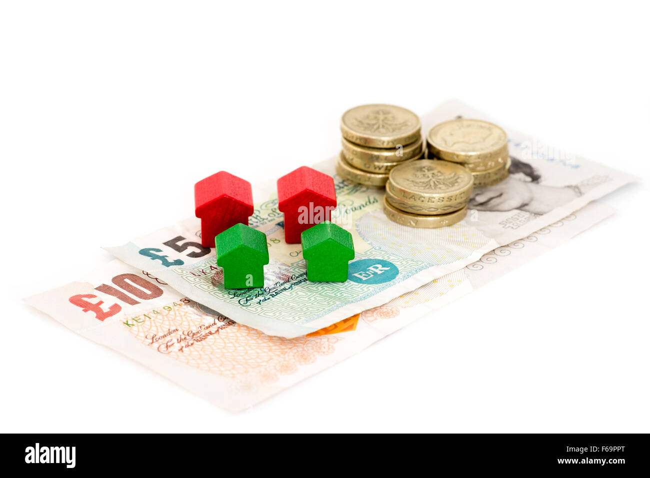 British currency and wood houses isolated on a white background Stock ...