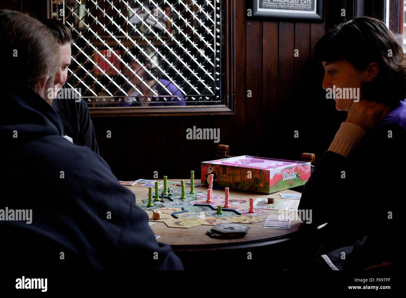 people playing a board game in a traditional pub england uk Stock Photo ...