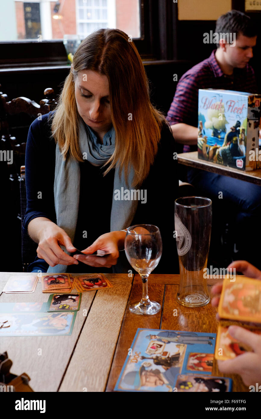 people playing a board game in a traditional pub england uk Stock Photo ...
