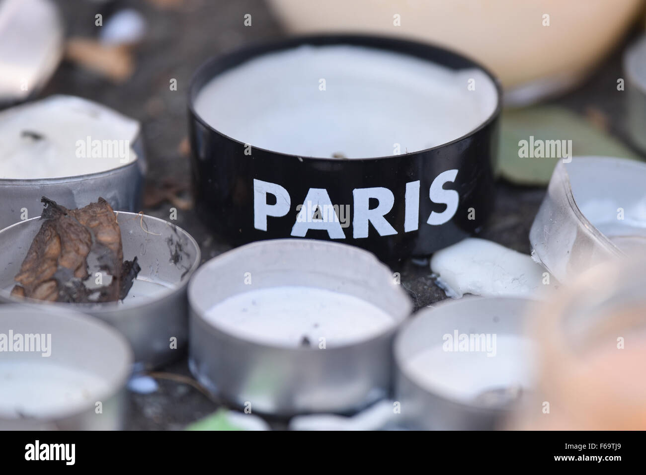 A candle with the word 'PARIS' stands in a shut off zone at the ...