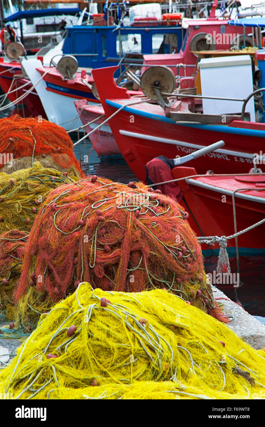 Fishnets in front of harbored fishing boats Stock Photo - Alamy