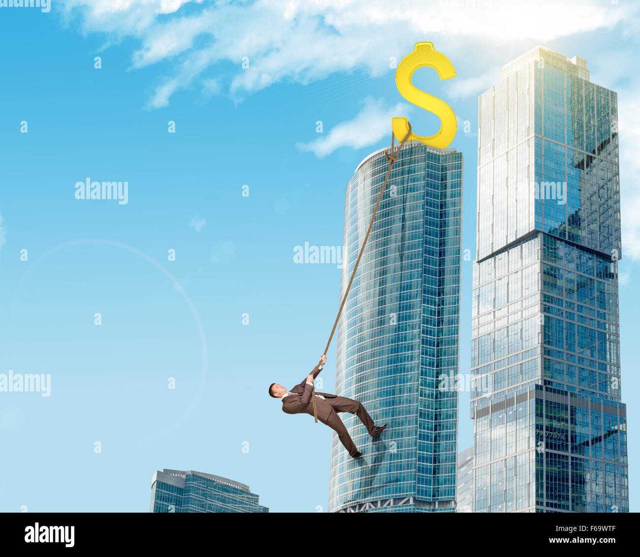 Businessman climbing skyscraper Stock Photo - Alamy