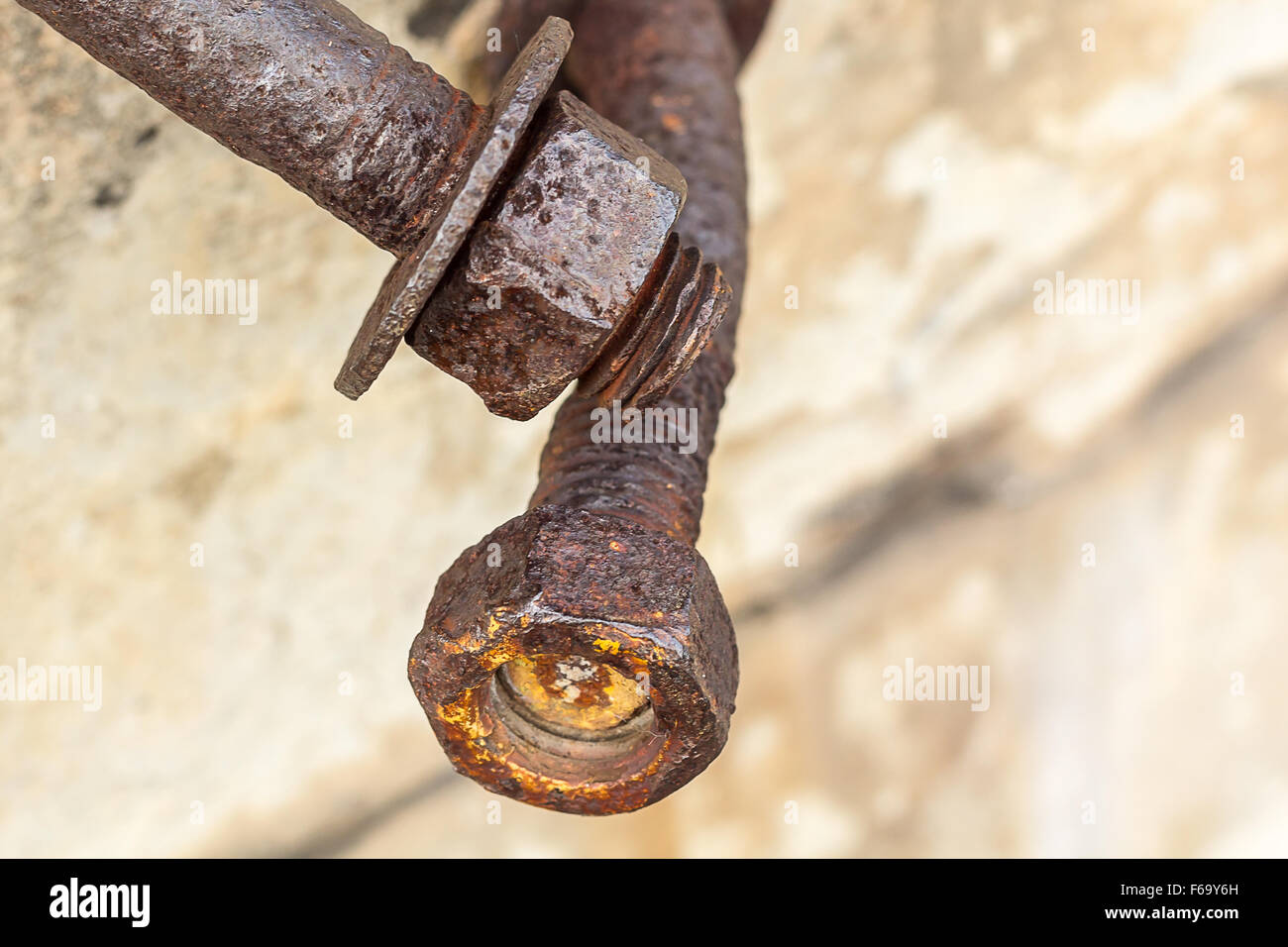 Corrosive rusted bolt with nut. Grunge industrial construction close up ...
