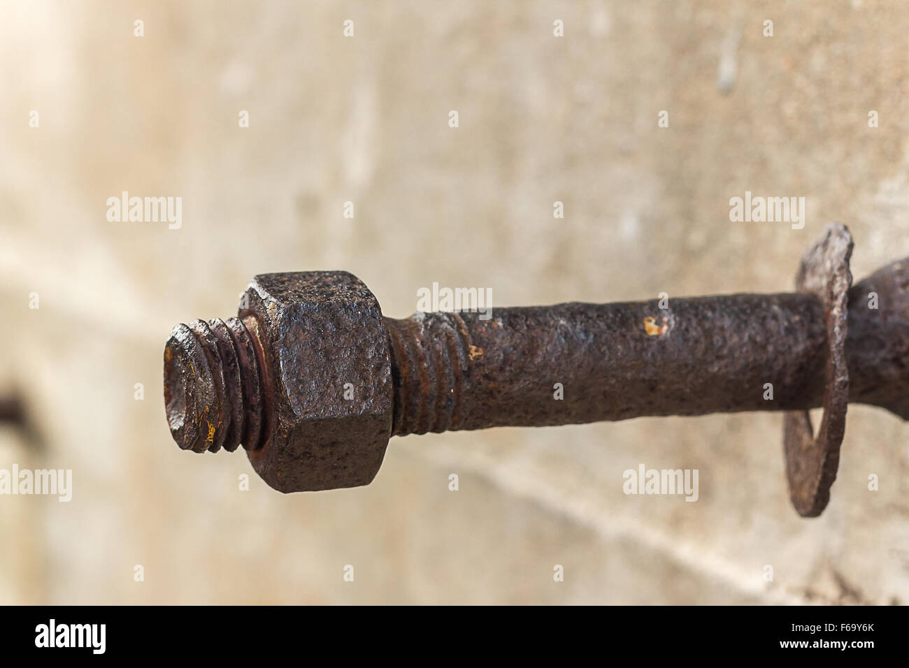 Corrosive rusted bolt with nut. Grunge industrial construction close up ...