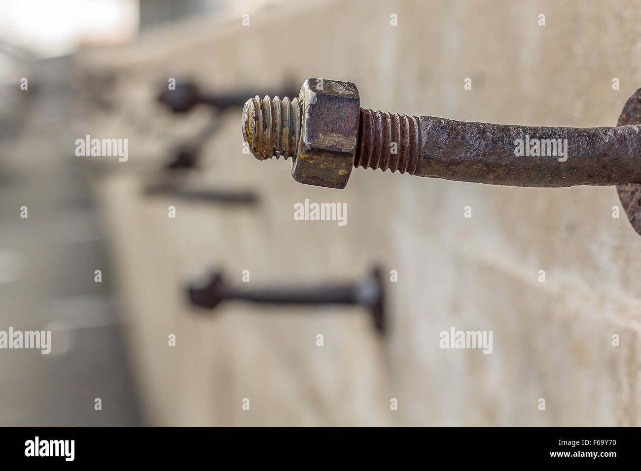 Corrosive rusted bolt with nut. Grunge industrial construction close up ...
