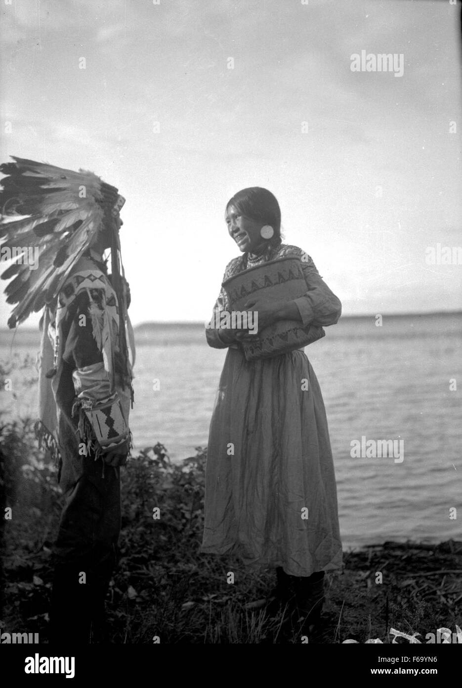 A young Cree couple is pictured by a serene lake in the Waterhen River ...