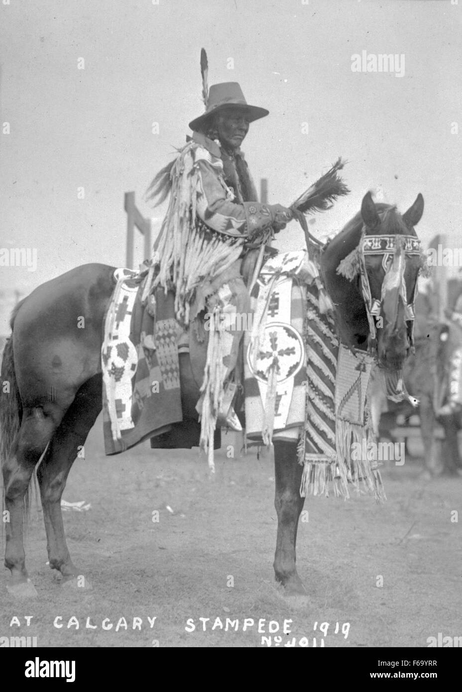 An unidentified First Nations man is pictured on horseback at Calgary ...