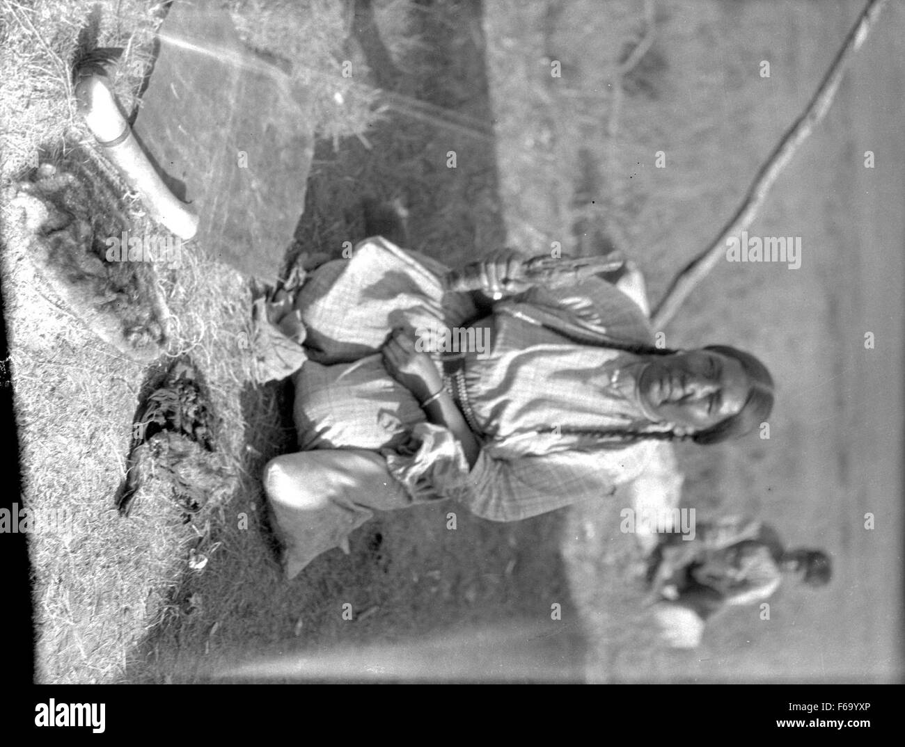 This historical photograph shows an unidentified Blackfoot woman in ...