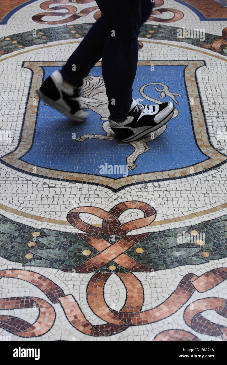 SPINNING ON THE BULL FOR GOOD LUCK - MILAN, ITALY Galleria Vittorio ...