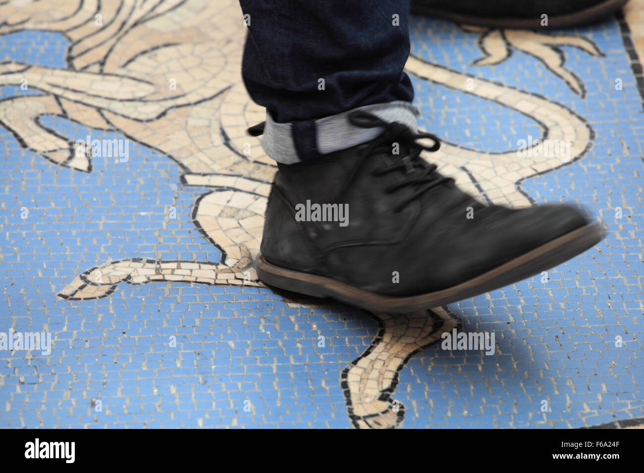 SPINNING ON THE BULL FOR GOOD LUCK - MILAN, ITALY Galleria Vittorio ...