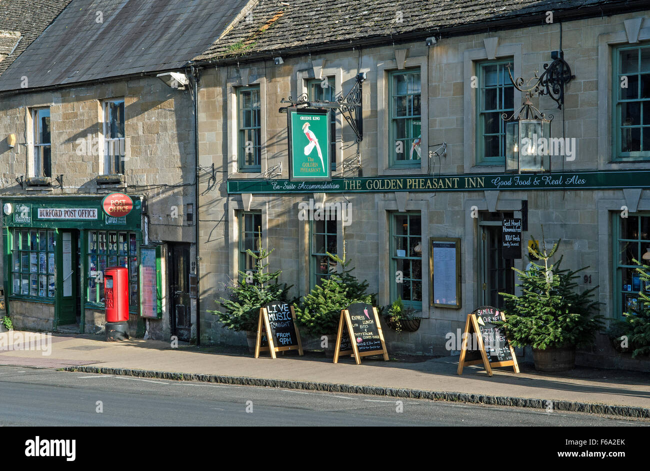 The Golden Pheasant Inn Burford High Street Cotswolds on a bright and ...