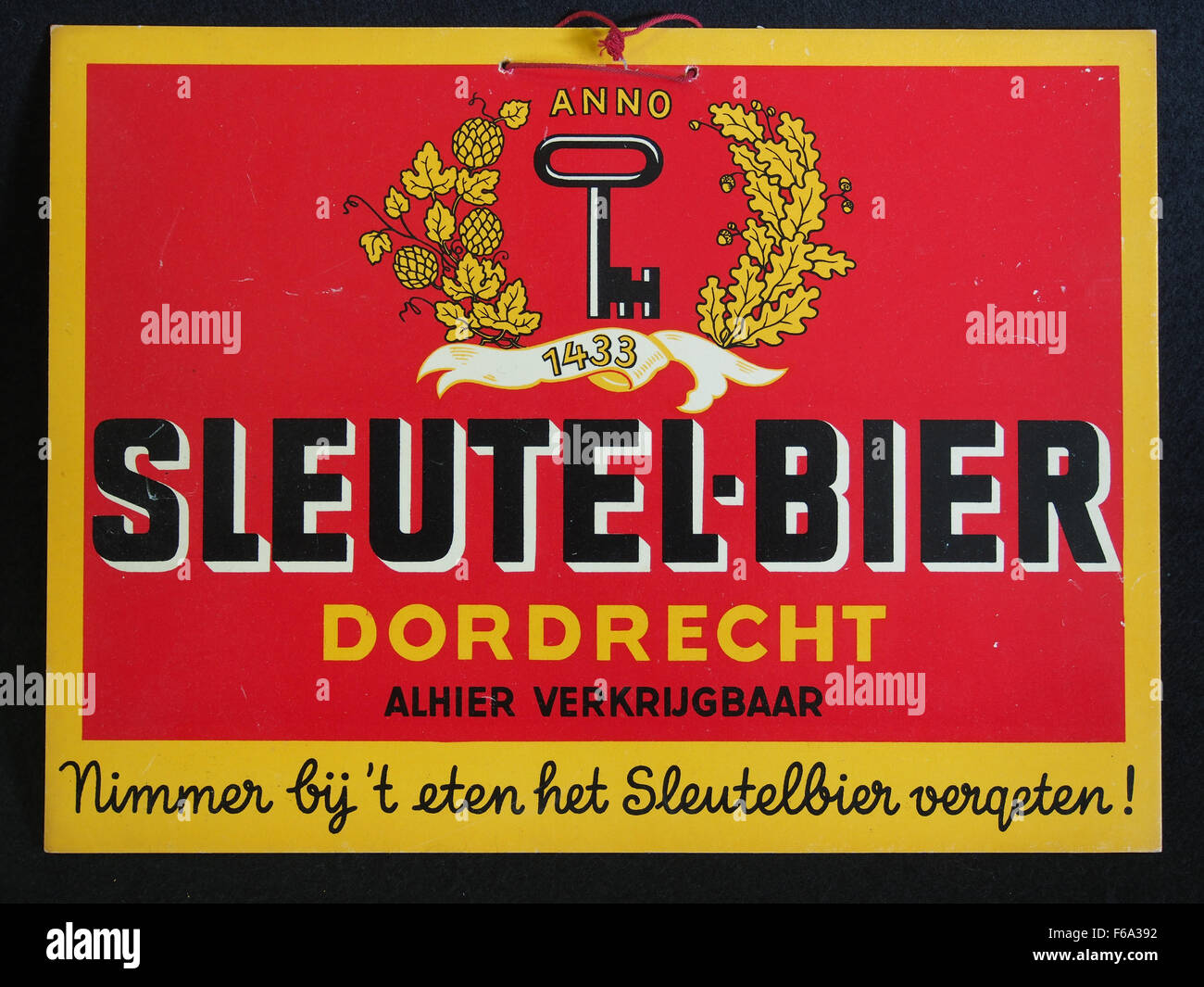 An old cardboard advertising board for Sleutel-Bier, showcasing vintage ...