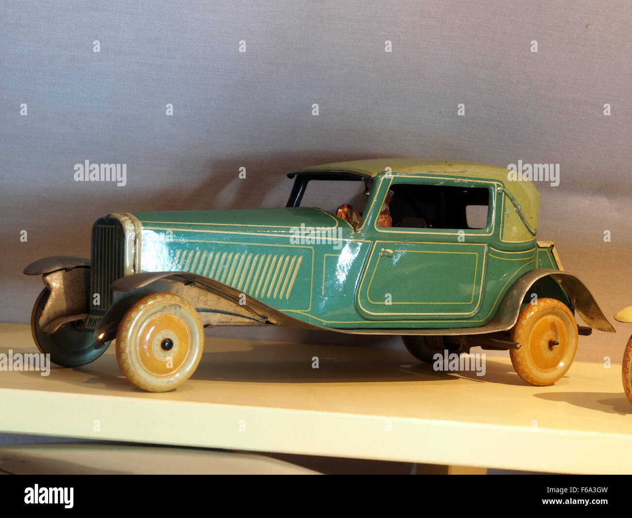 A vintage tin toy car on display at the Deventer Toy Museum, captured ...